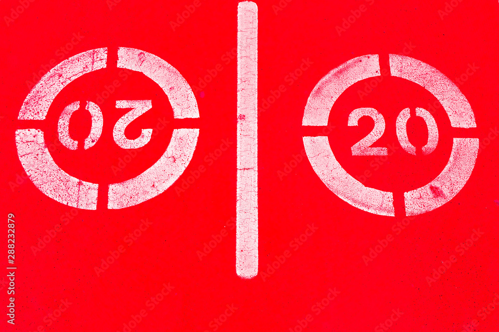 20, number twenty, speed limit white sign painted on bright red ...