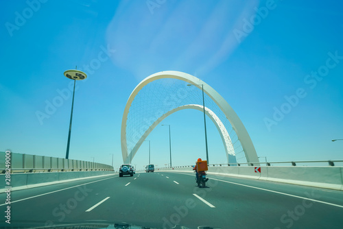 Lusail Expressway Memorial Arches crossing the highway interchange in ...