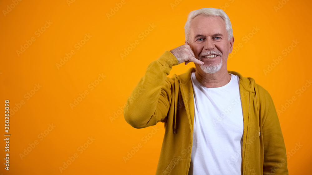 Retired male showing call me gesture, flirting on camera, communication ...