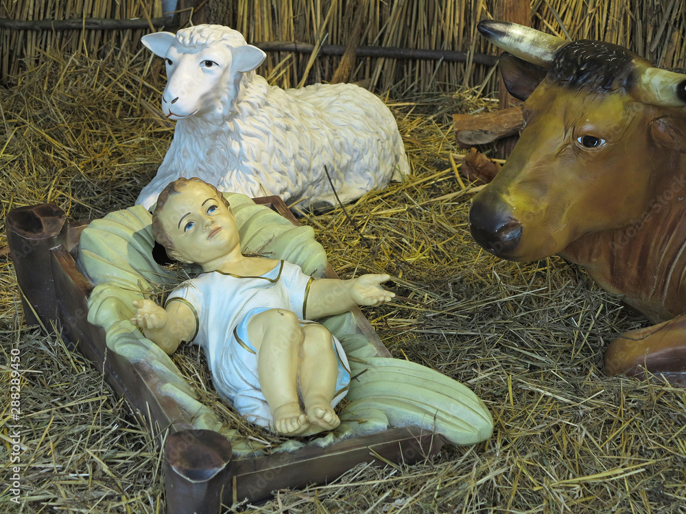 Realistic christmas nativity scene with figurines including Jesus and ...