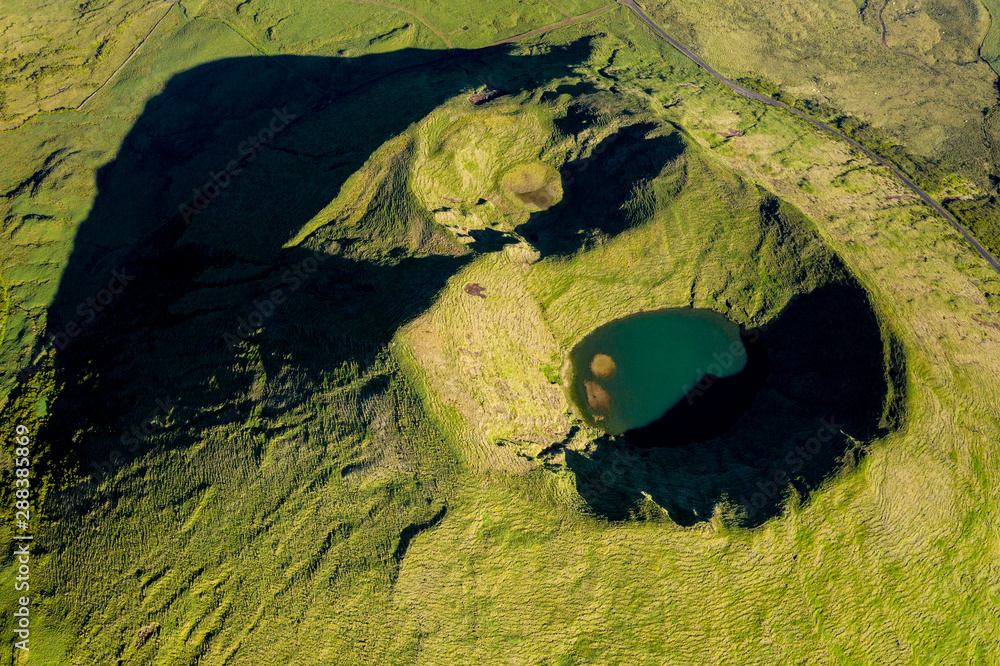 Aerial image of typical green volcanic caldera crater landscape with ...