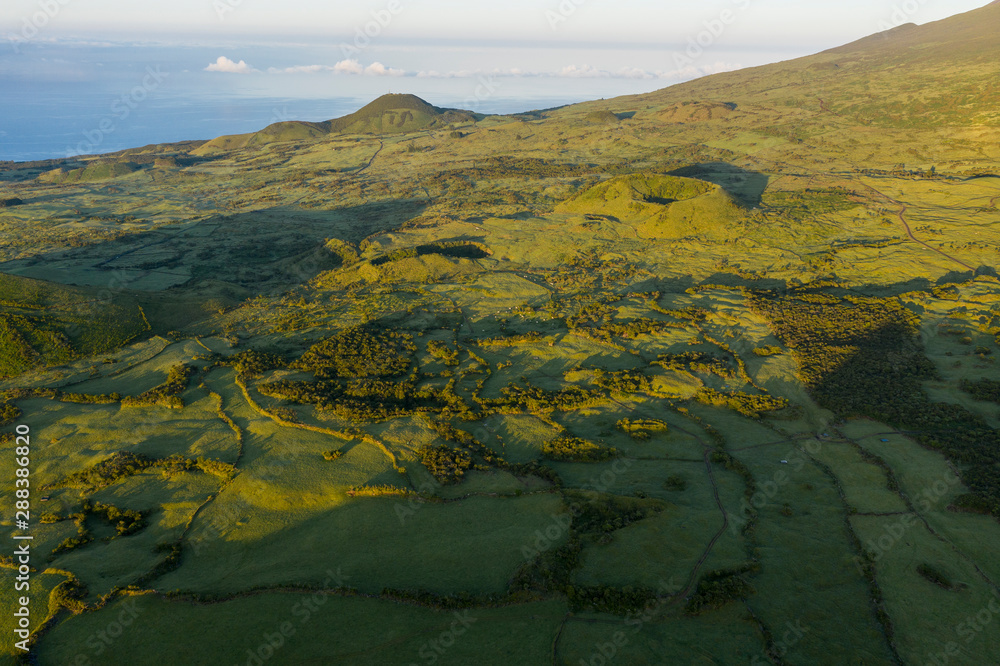 Aerial image of typical green volcanic caldera crater landscape with ...