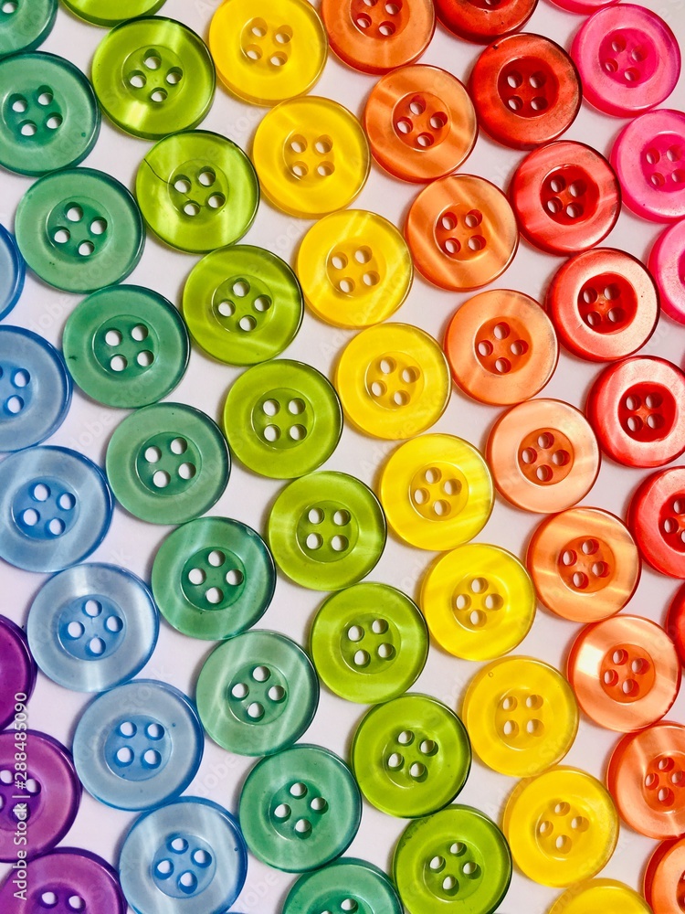 Lines of coloured plastic buttons Stock Photo | Adobe Stock