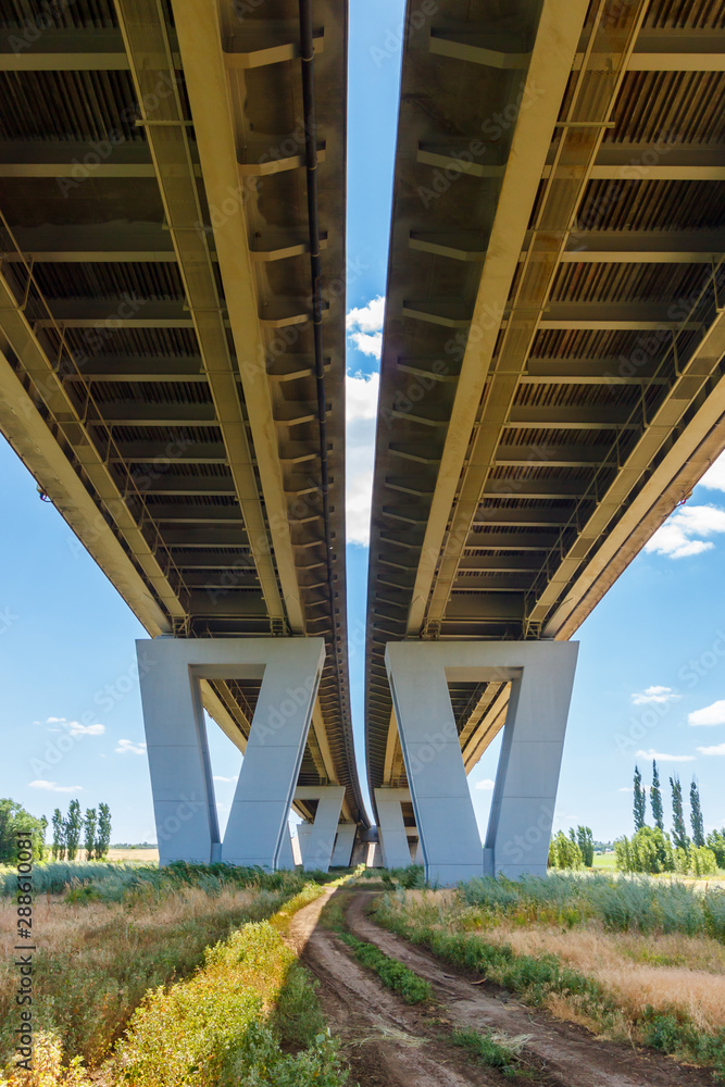 The bottom part of a modern two way bridge with triangle pillars ...