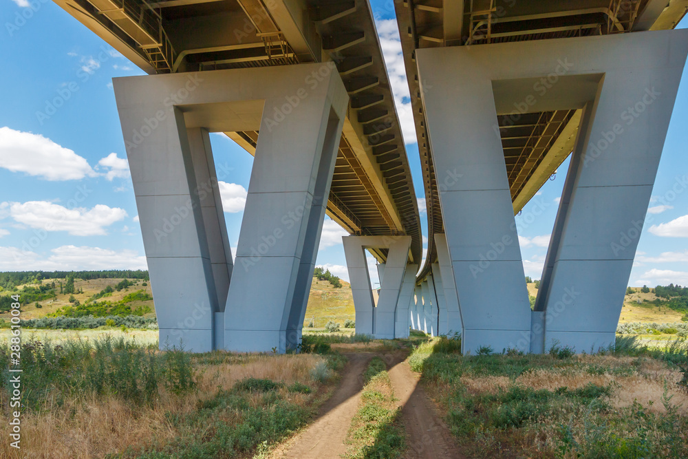The bottom part of a modern two way bridge with triangle pillars ...