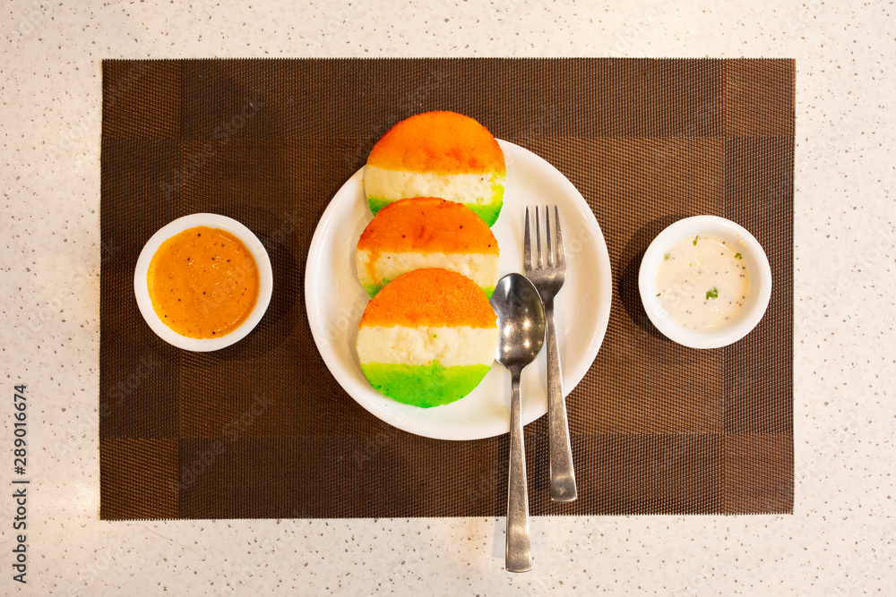 South Indian Food Tiranga Idly or Idli Served With Chutneys Made From ...