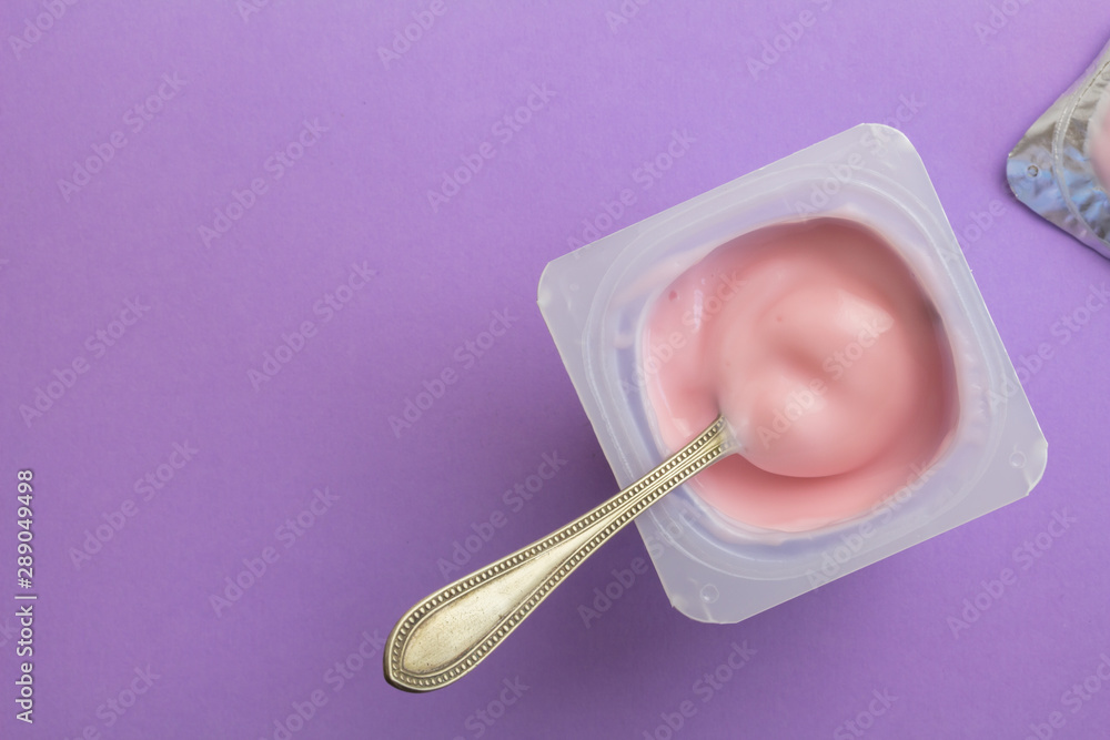 Yogurt in plastic cup with spoon - Top view of pink strawberry ... Yogurt in plastic cup with spoon - Top view of pink strawberry ...