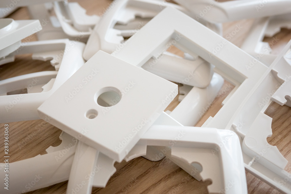 TV coaxial socket and the stack of socket frames on the light wooden ...