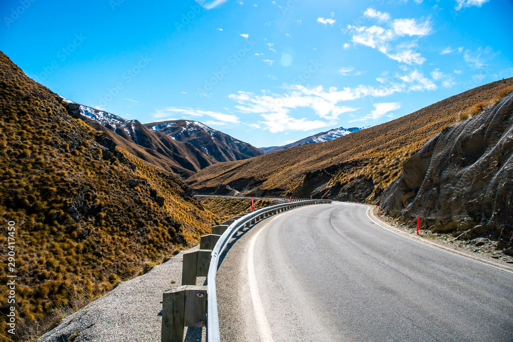 Alpine Pass road winding its way through the extreme terrain in New ...