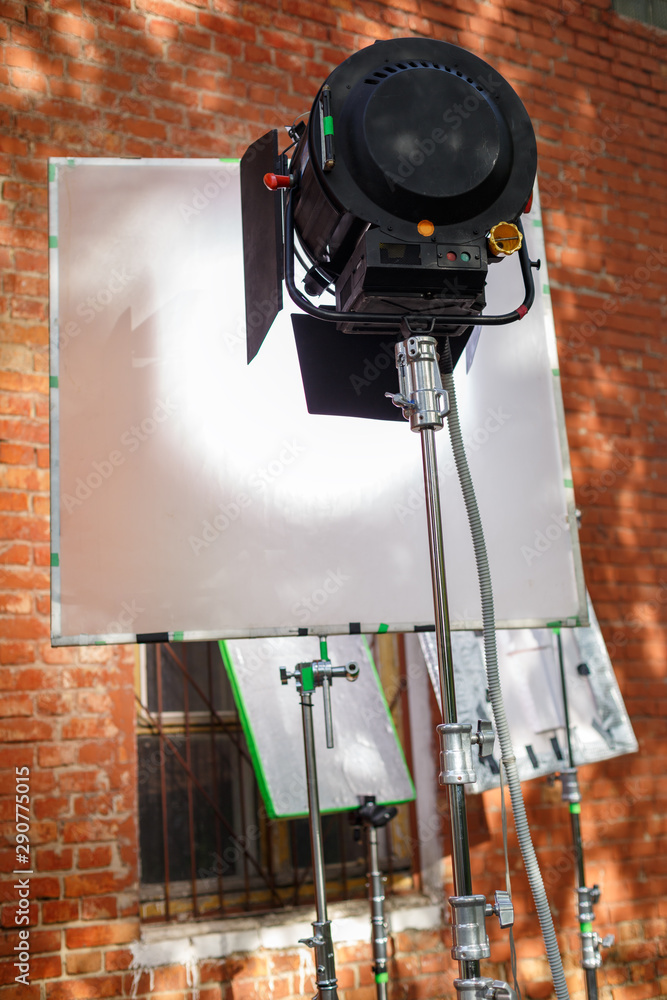 Process of filming. Spotlight illuminates window. Stock Photo | Adobe Stock