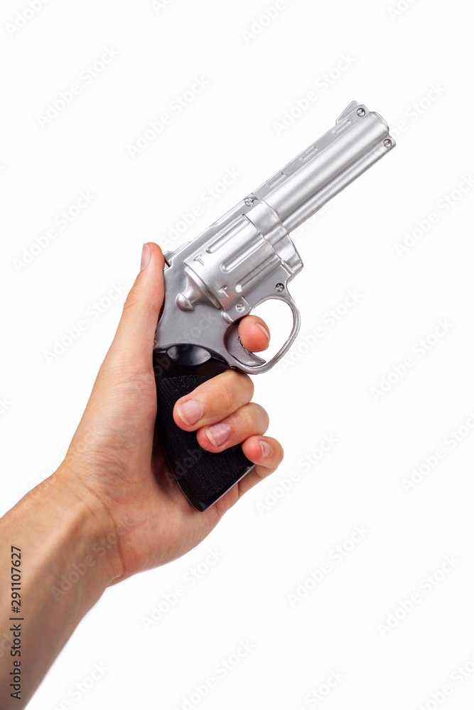 Photo Stock Hand holding up a silver revolver pulling the trigger, gun ...
