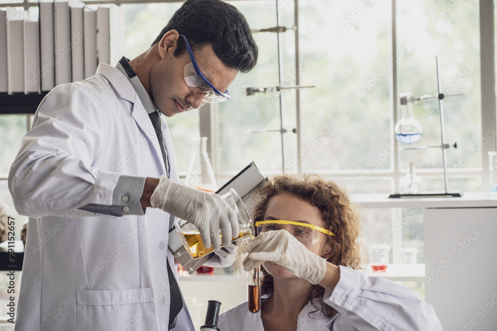 Team of Medical Research Scientist Conducts Experiments in Laboratory ...