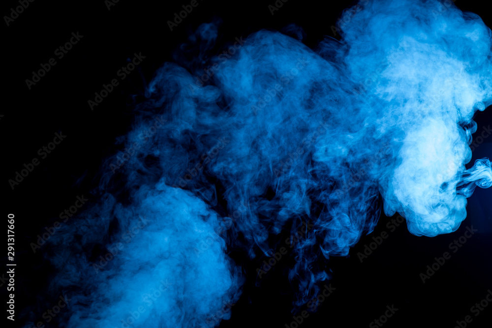 Blue billowing smoke on black background Stock Photo | Adobe Stock