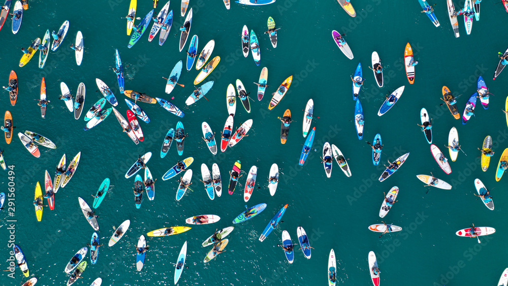 Aerial bird's eye view photo taken by drone of stand up paddle surfers ...