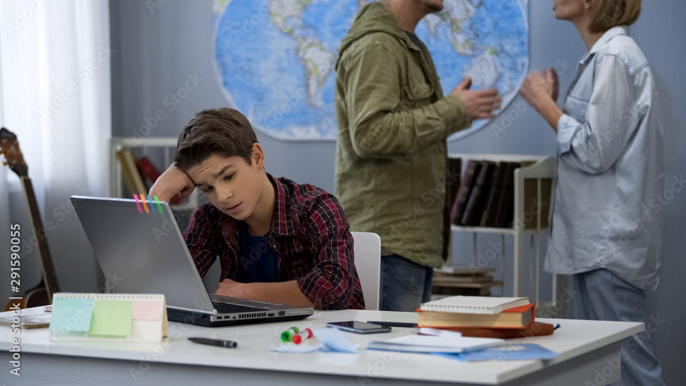 Annoyed parents arguing behind sad child back, family misunderstanding ...