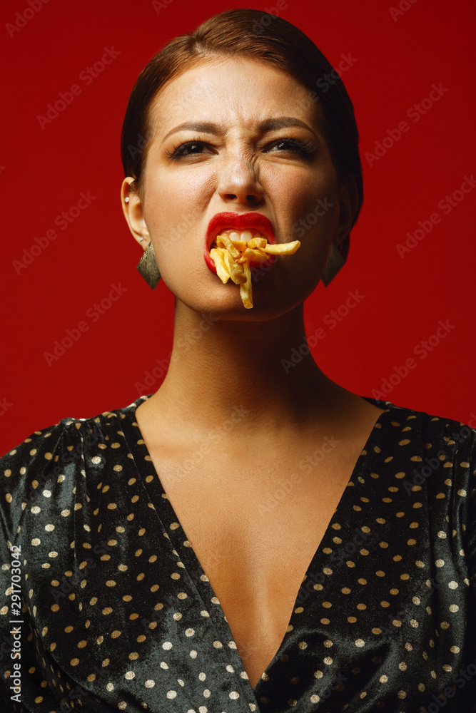 Unhealthy eating. Junk food obsession concept. Arty portrait of ...