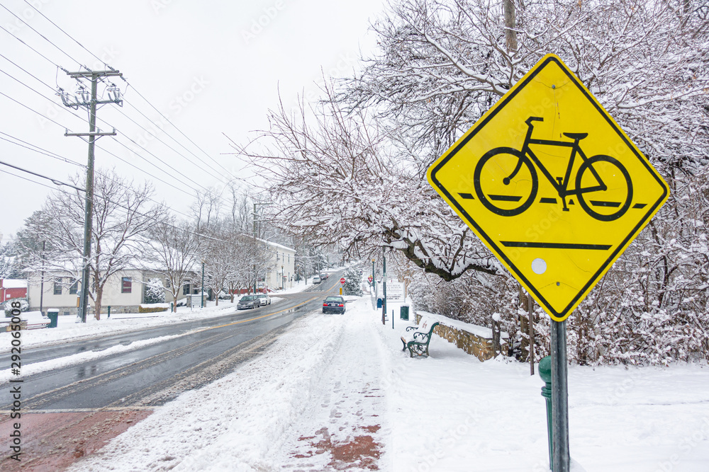 Slush and Sleet of Snow on roads nest to the Bicycle Crossing Sign ...