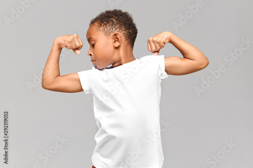 Children, fitness and bodybuilder concept. Studio shot of athletic ...