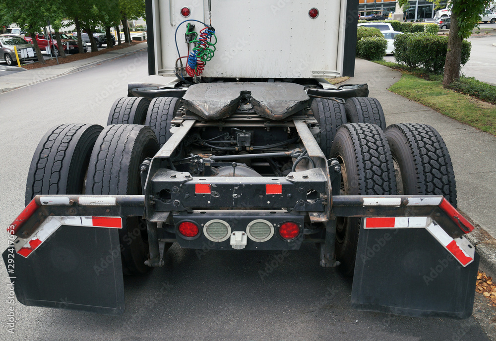Rear of the tractor unit. Visible fifth wheel couplings are fitted to a ...