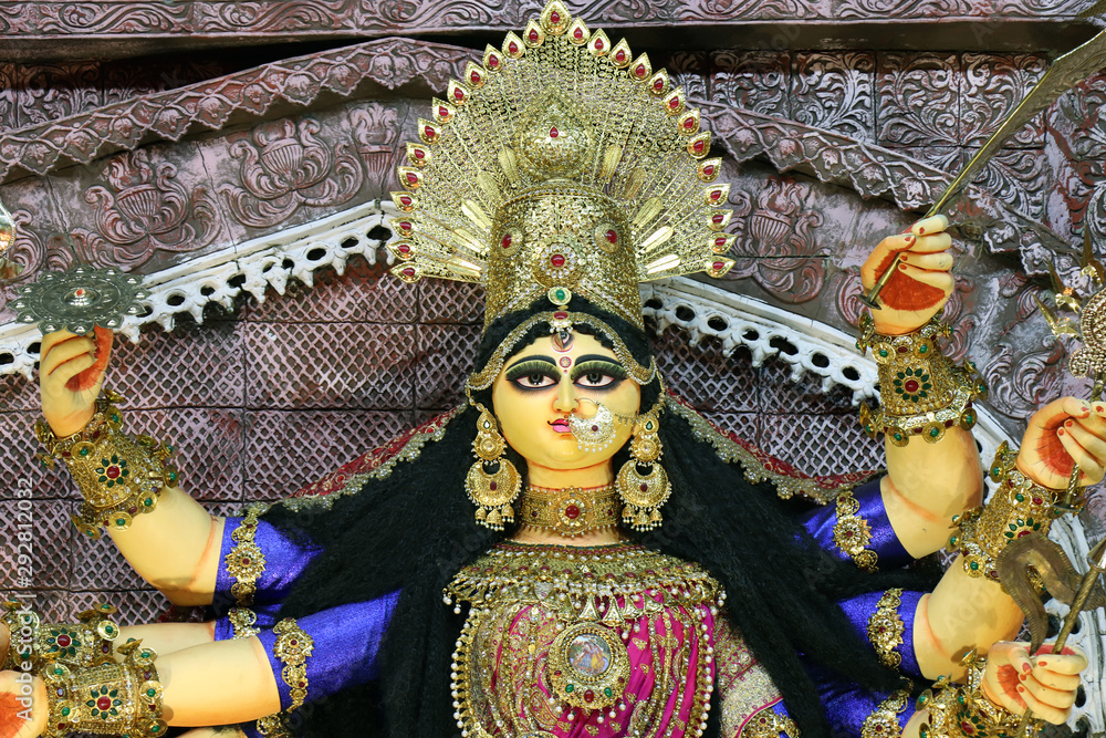 Goddess Durga idol at decorated Durga Puja pandal, shot at colored ...