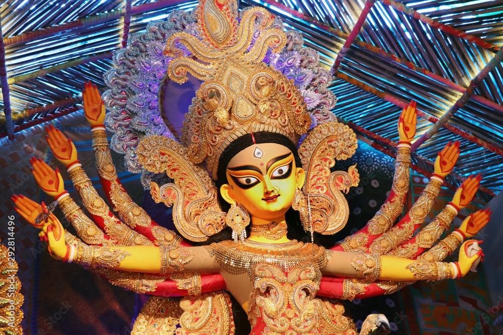 Goddess Durga idol at decorated Durga Puja pandal, shot at colored ...