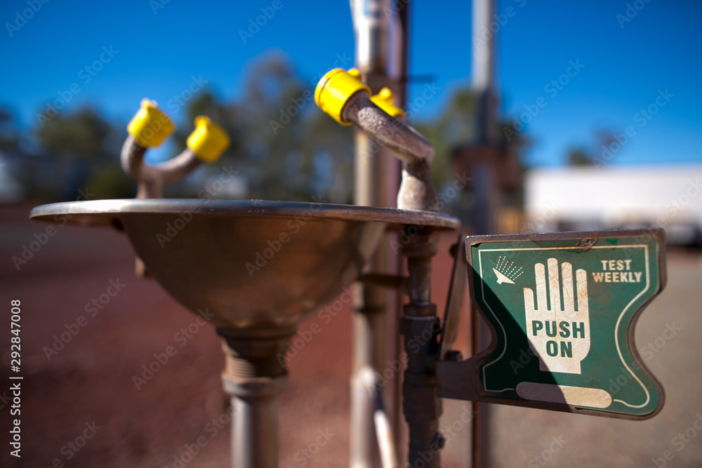 Industrial safety shower sign and eyes wash emergency station at ...