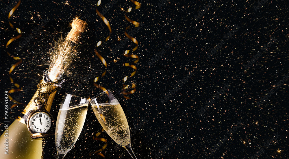 Foto de Stock New year party concept with a exploding champagne bottle ...