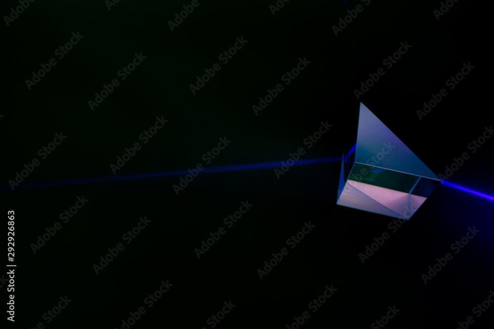 Laser beam and optical glass on black background Stock Photo | Adobe Stock
