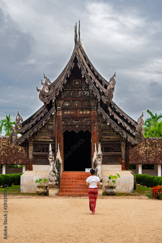 Young grils traveling Wat Ton Kain, Old temple made from wood know as ...