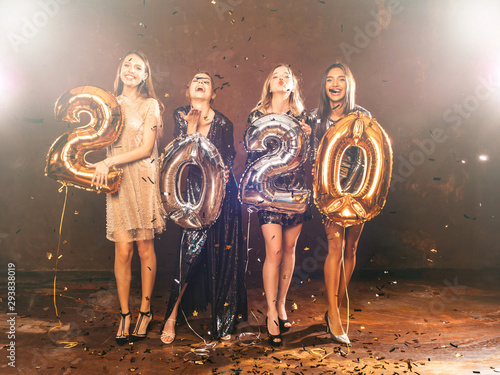 Beautiful Women Celebrating New Year Happy Gorgeous Girls In Stylish Sexy Party Dresses Holding