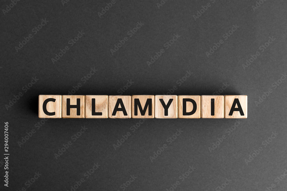 Chlamydia - word from wooden blocks with letters, parasitic bacterium ...