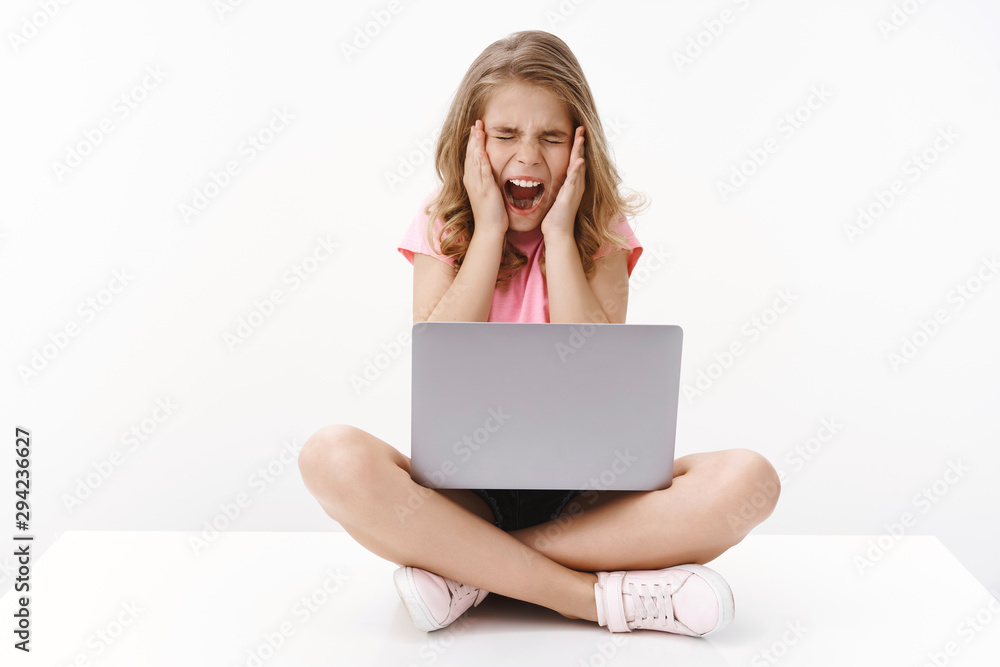 Scared terrified young cute caucasian blond girl scream from fear, sit ...