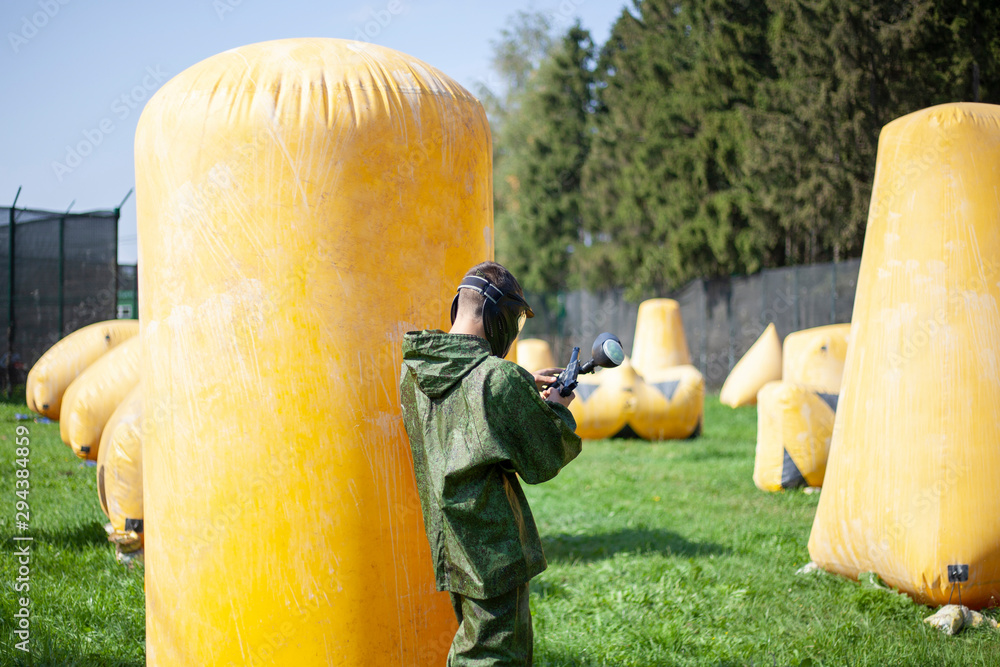 Paintball players on the training ground. The game of shooting paint ...