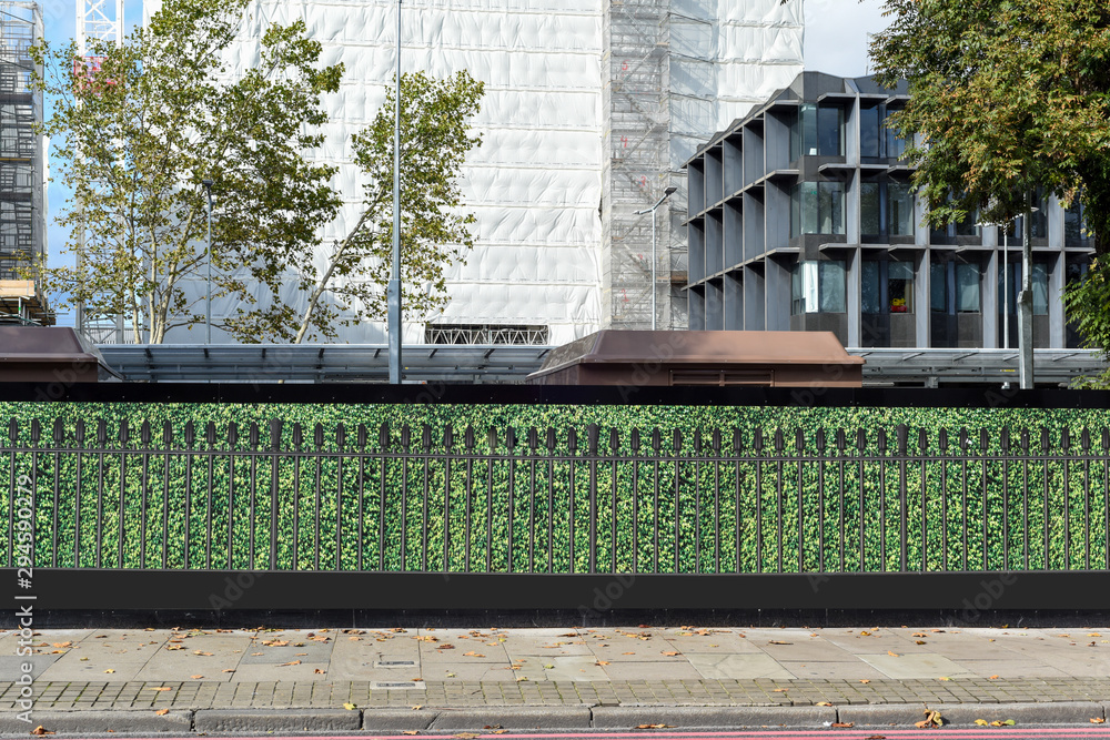 Fake hedge hoarding protects public from works at the construction site ...