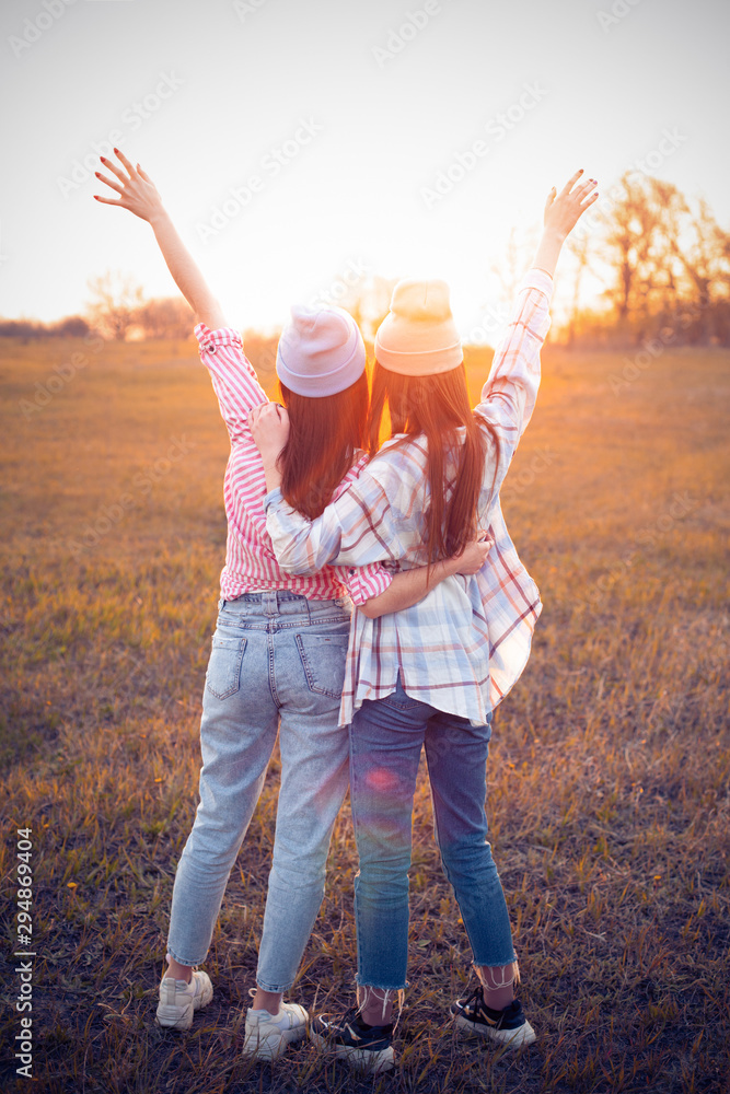 Two Best Friends Holding Hands In The Sunset
