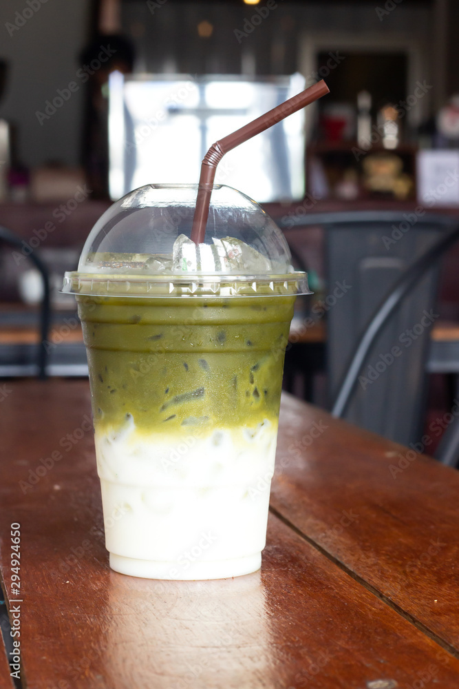 Iced matcha latte green tea in plastic cup. Healthy drink. Favorite ...