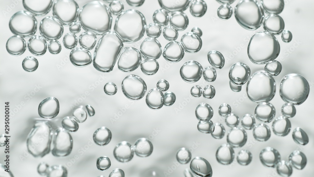 transparent gas bubbles on water surface. Worms-eye low angle with ...