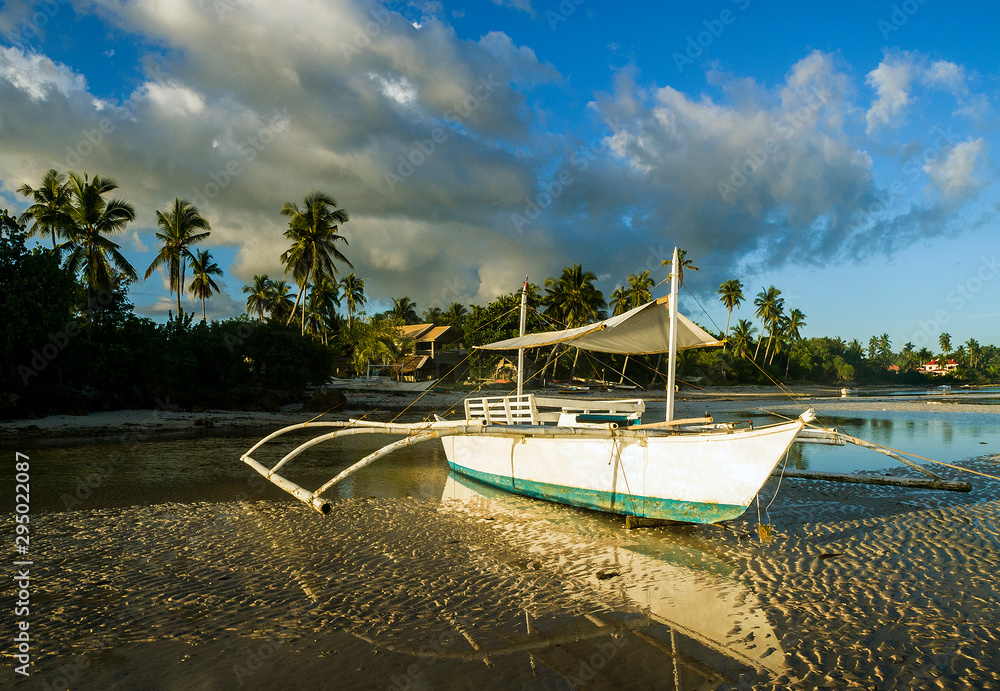 Traditional Filipino fishing boat known as "bangka" at Danao beach ...
