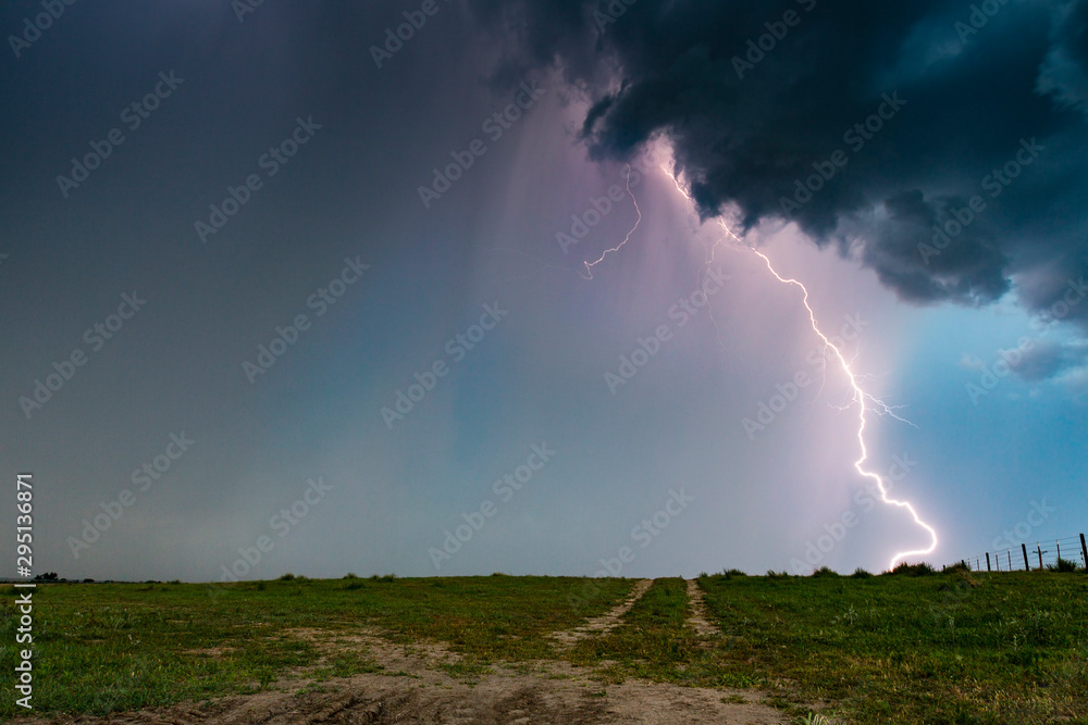 Dramatic bolt of lightning hitting the ground from supercell ...
