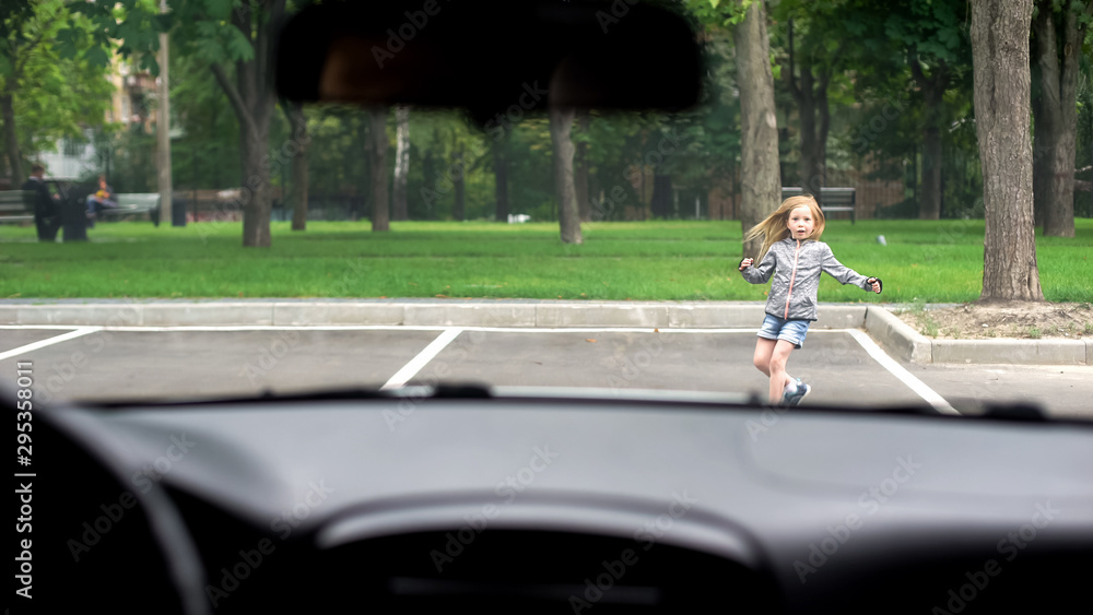 Female kid running front driving car, road traffic safety rules ...