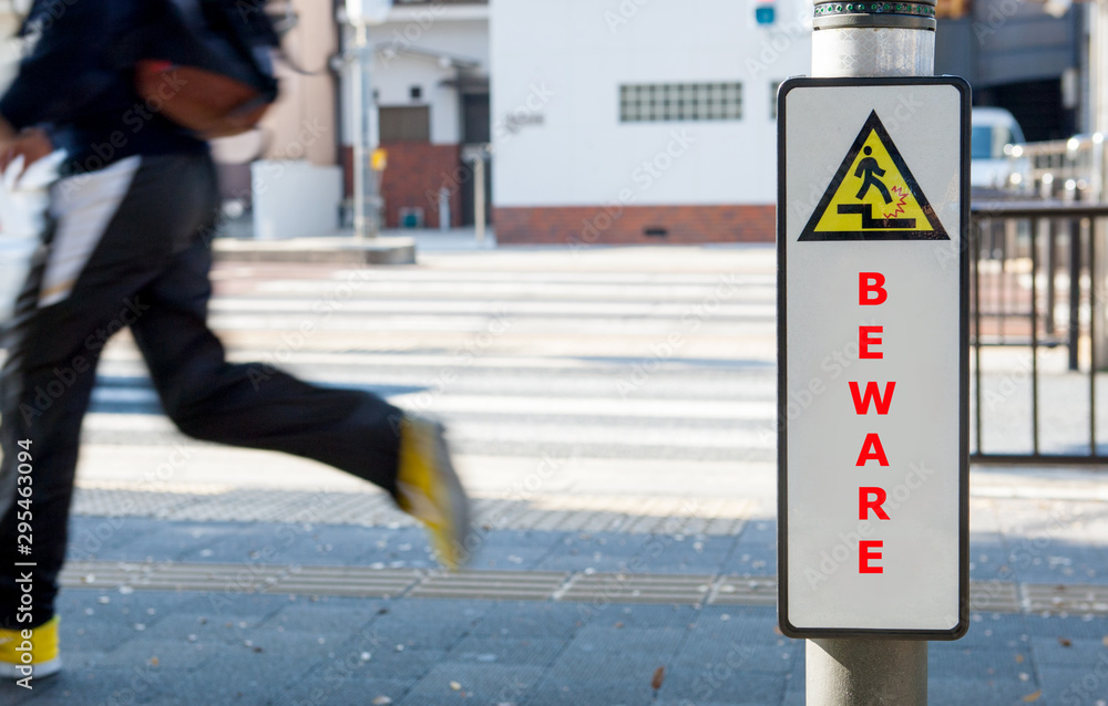 Warning sign Be careful when traveling due to different levels of floor ...