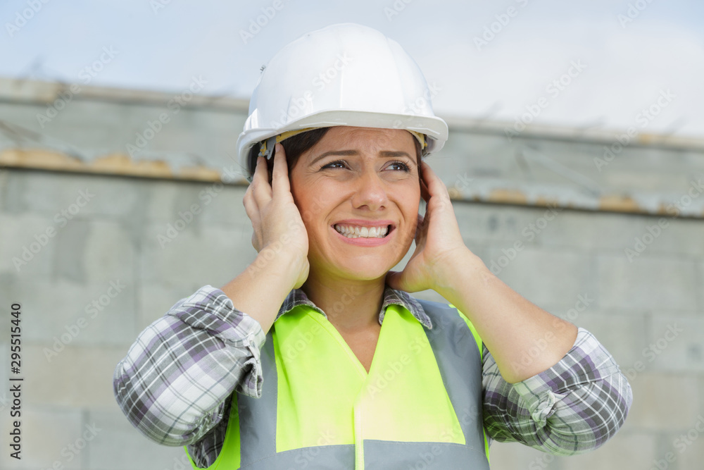 engineer construction worker woman covering ears Stock Photo | Adobe Stock