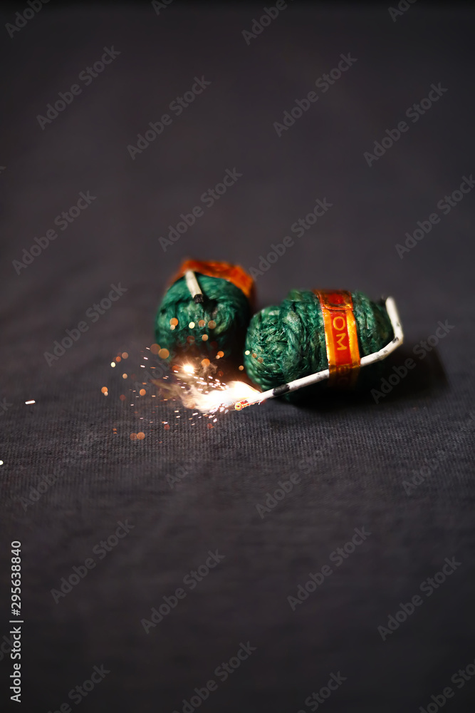 Diwali fire bomb cracker on black background Stock Photo | Adobe Stock