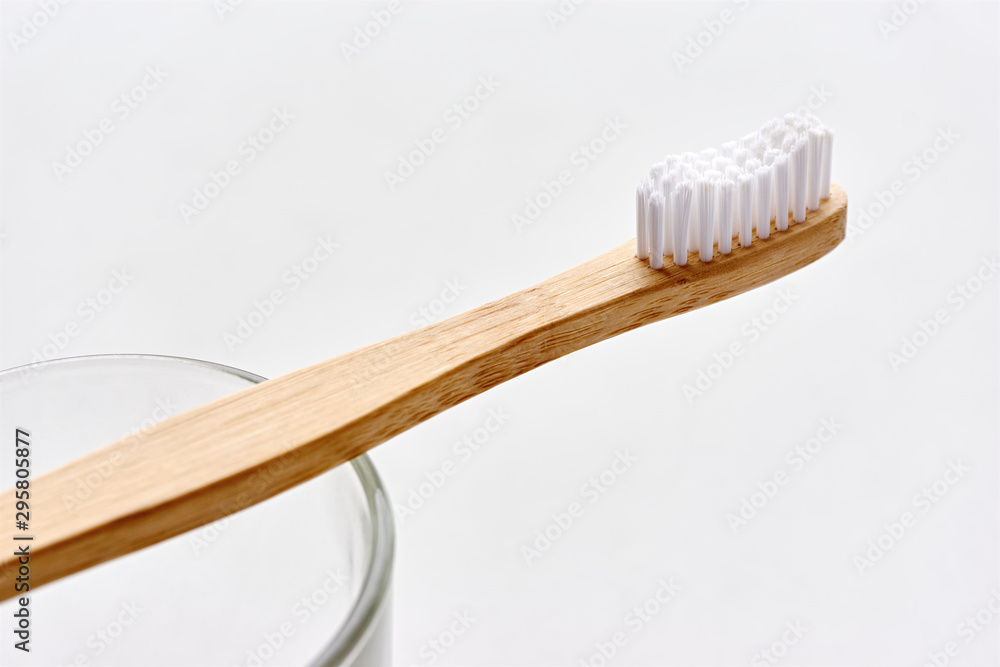 Closeup of a wooden toothbrush. Simple bamboo biodegradable eco ...