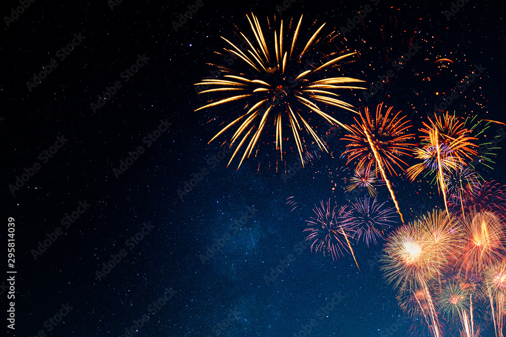 ภาพถ่าย Stock Fireworks with blur milky way background | Adobe Stock