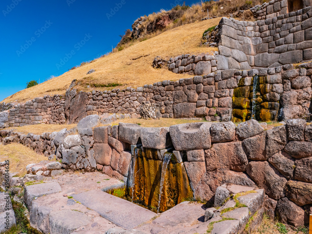 Fountain with different waterfalls. Water falls from the top through ...