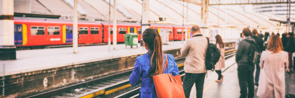 Commuters going to work waiting at train station platform in London ...