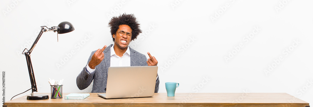 Foto young black businessman feeling provocative, aggressive and ...