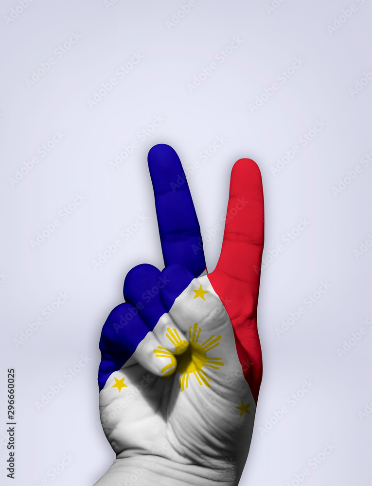 Peace hand sign of a Filipino, hand painted in the Philippine flag. 素材庫 ...