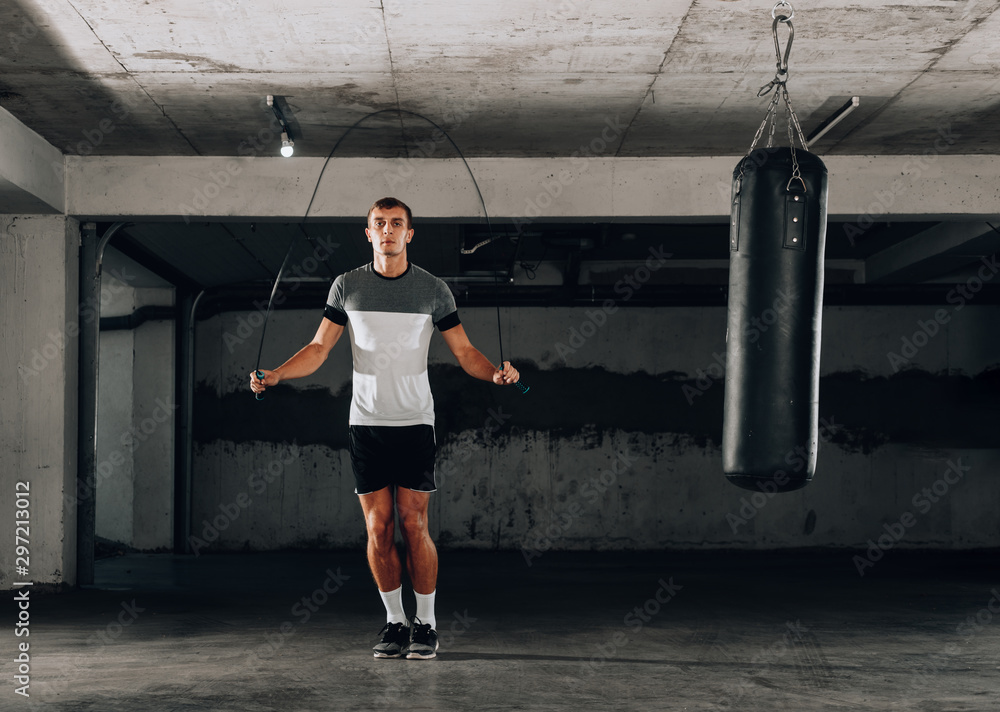Muscular man skipping exercise with jumping rope Stock Photo | Adobe Stock